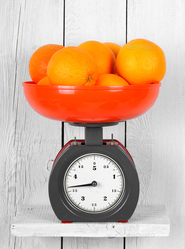 Oranges on scales Stock Photo by Artem_ka | PhotoDune