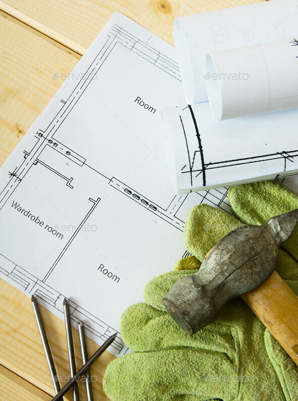 Repair work. Drawings for building, hammer and gloves on wooden ...