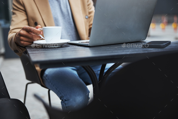 Focused photo on male hand talking cup Stock Photo by Iakobchuk | PhotoDune