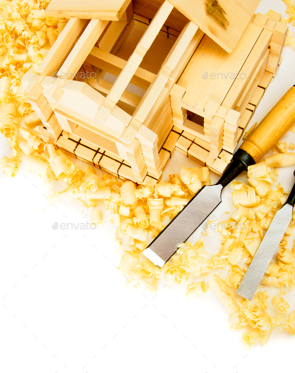 House construction. Joiner's works. The wooden house, chisel and ...