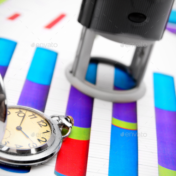 Watch and stamp on the graphs. Stock Photo by Artem_ka | PhotoDune