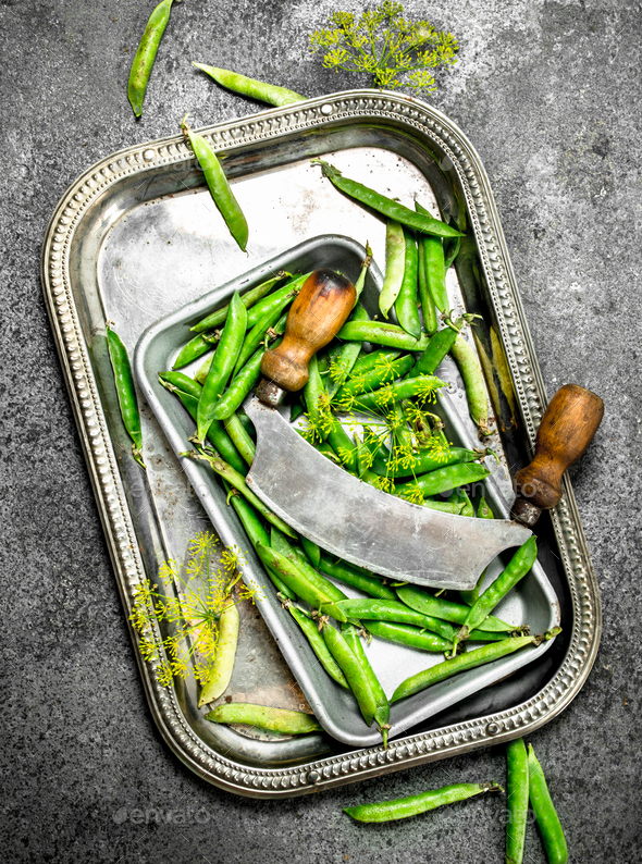 Green peas with an old knife. Stock Photo by Artem_ka | PhotoDune
