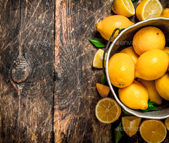 Ripe lemons in the old bucket. Stock Photo by Artem_ka | PhotoDune