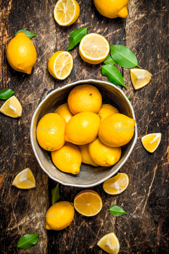 Ripe lemons in the old bucket. Stock Photo by Artem_ka | PhotoDune