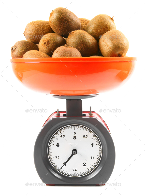 Kiwi on scales Stock Photo by Artem_ka | PhotoDune