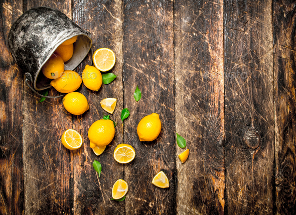 Ripe lemons in the old bucket. Stock Photo by Artem_ka | PhotoDune