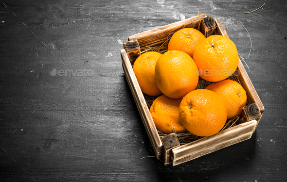 Fresh oranges in an old box. Stock Photo by Artem_ka | PhotoDune