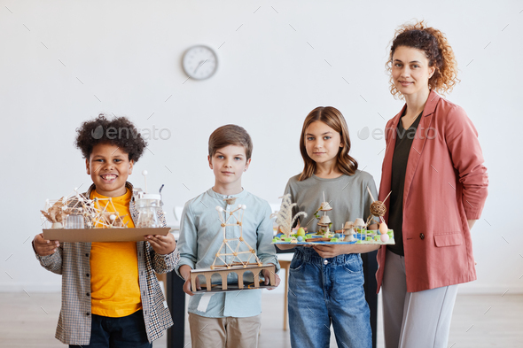Kids Presenting Projects in School Stock Photo by seventyfourimages