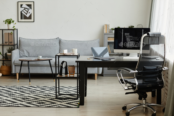 Modern living room with workplace Stock Photo by seventyfourimages