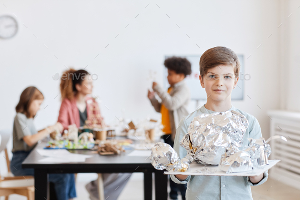 Boy Presenting Project in School Stock Photo by seventyfourimages ...