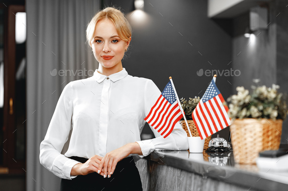 Portrait of beautiful blonde woman hotel receptionist Stock Photo by ...