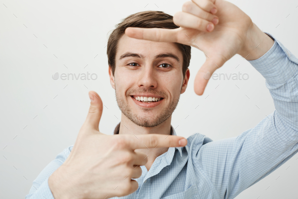 Close-up portrait of positive good-looking successful photographer ...
