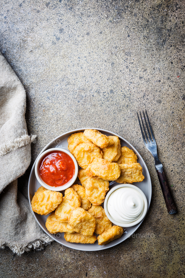 Crispy fried chicken nuggets Stock Photo by ipolly80 | PhotoDune