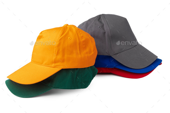Stack of baseball caps isolated on white background Stock Photo by ...