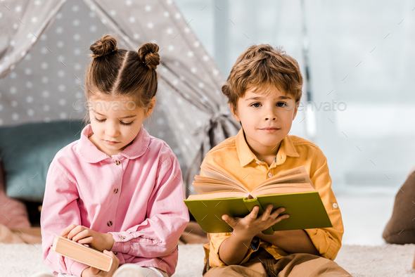 adorable little children reading books together Stock Photo by ...