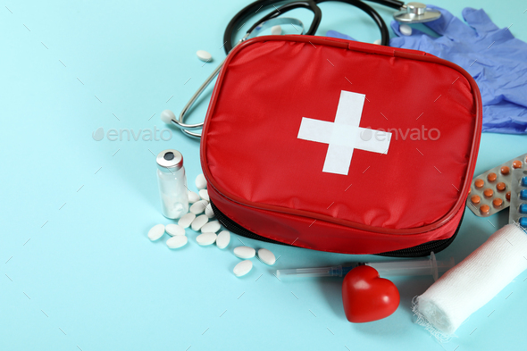 First aid medical kit on blue background Stock Photo by AtlasComposer