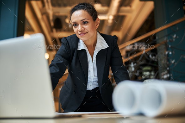 Delighted brunette woman looking at screen of computer Stock Photo by ...