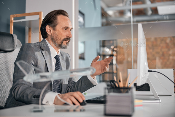 Good-looking gentleman using modern computer at work Stock Photo by ...