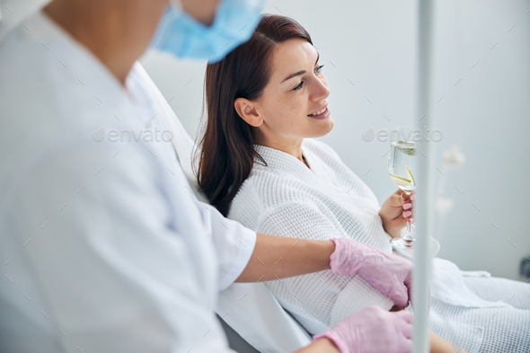 Patient smiling during the intravenous vitamin therapy Stock Photo by ...