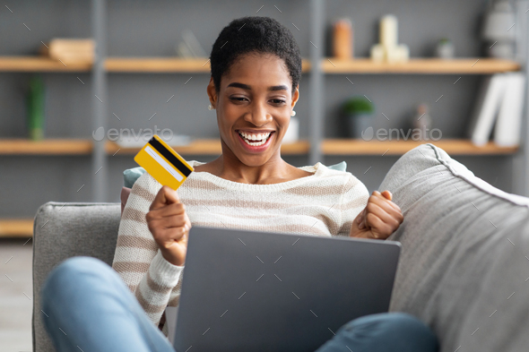 Online Banking. Cheerful Black Woman With Laptop And Credit Card At ...