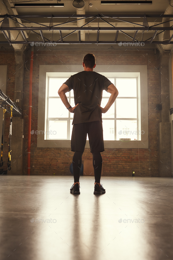Sport is my lifestyle. Back view of young athletic man in sportswear ...