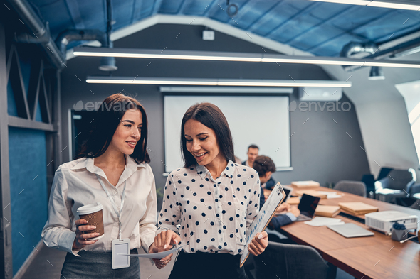 Two business women are talking in office Stock Photo by Iakobchuk ...
