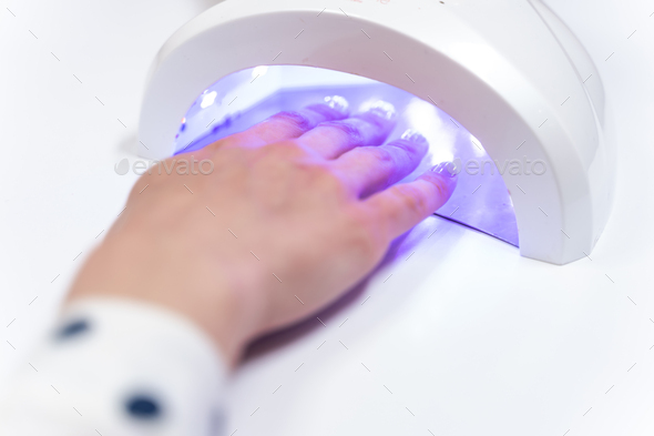 Professional ultraviolet lamp being in use for client Stock Photo by ...