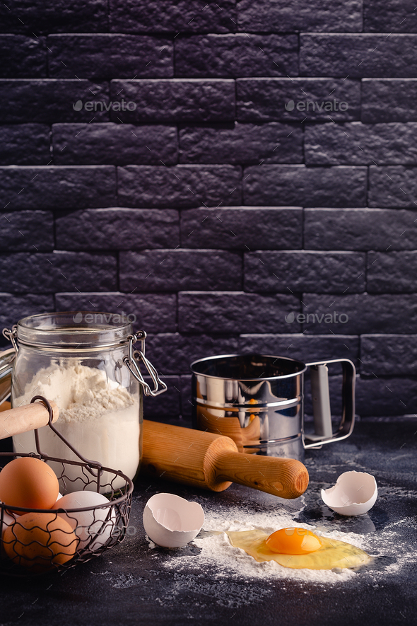 Table with baking products and tools. Stock Photo by tatiana_bralnina