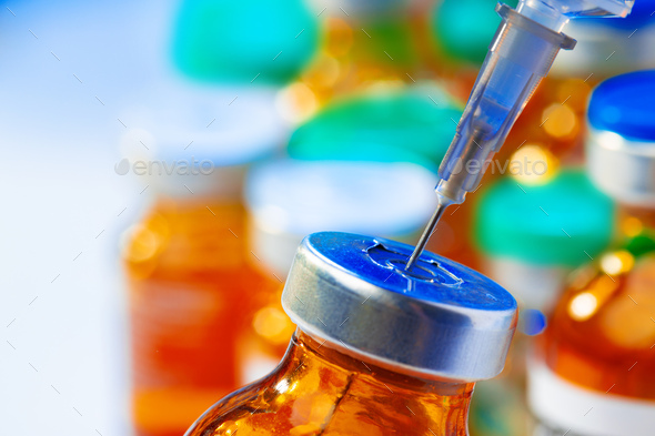 Medical vial with medication and syringe close up Stock Photo by ...