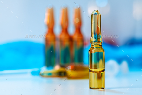 Plain ampule vials for injections close up Stock Photo by FabrikaPhoto