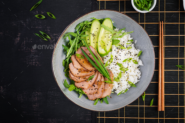 Homemade baked sliced beef and rice bowl with salad. Diet menu. Top ...