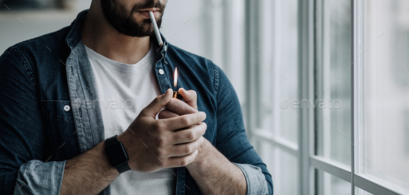 Frustrated stressed young man smoking cigarette, unhealthy habits and ...