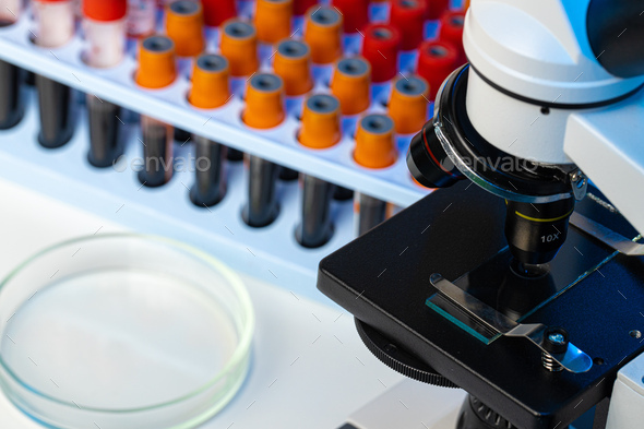 Close up photo of a microscope lenses examining glass sample Stock ...