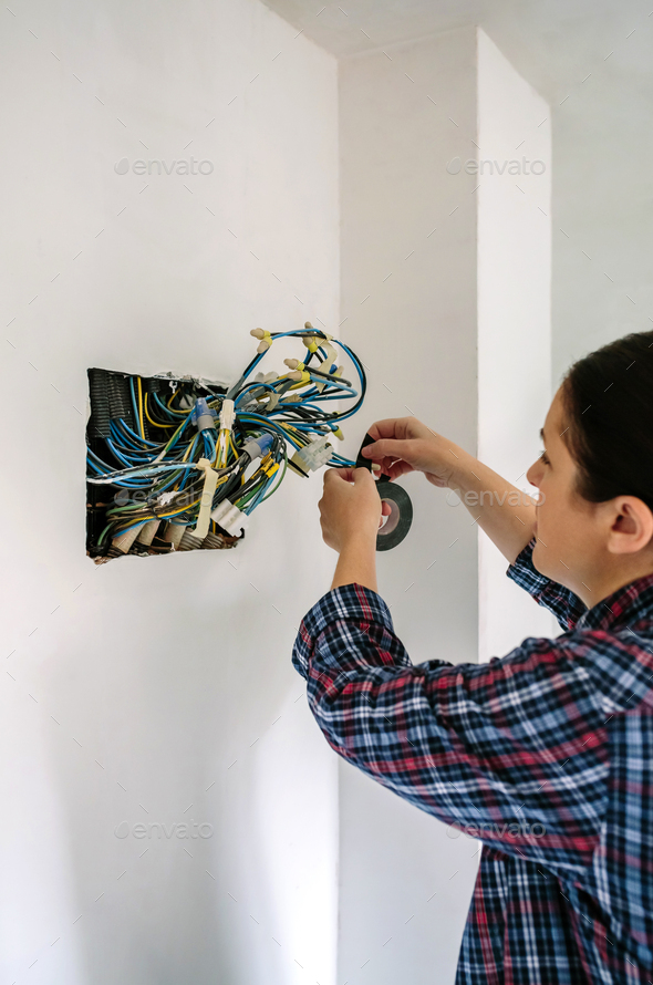 Electrician working on the electrical installation of a house Stock ...