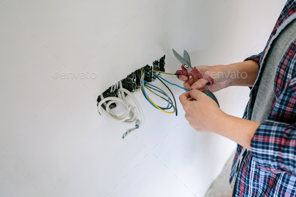 Electrician working on the electrical installation of a house Stock ...