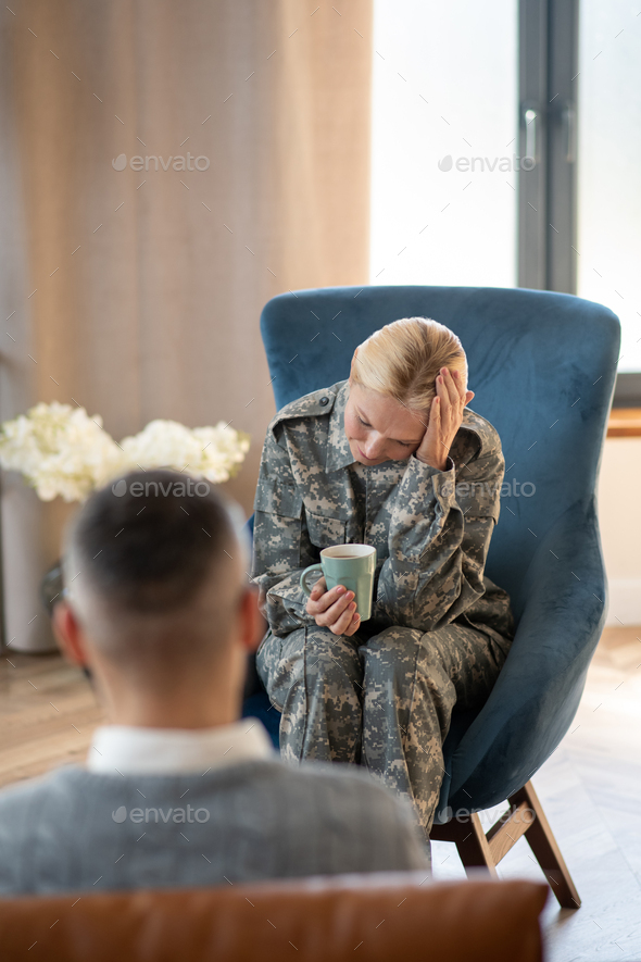 Military woman suffering from insomnia coming to psychologist Stock ...