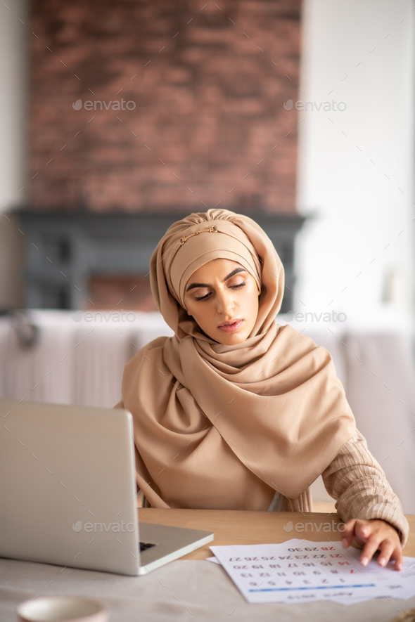 Beautiful girl doing some work sitting near laptop Stock Photo by ...