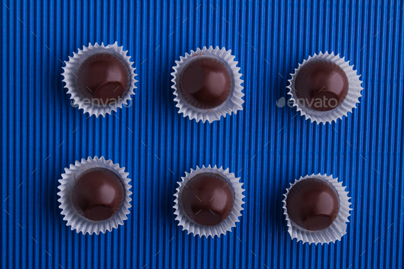 Set of six brown chocolate candies with wrap. Stock Photo by ...