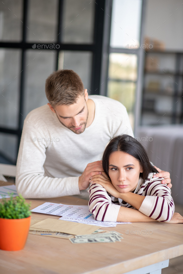 Husband supporting wife after family budget planning Stock Photo by ...