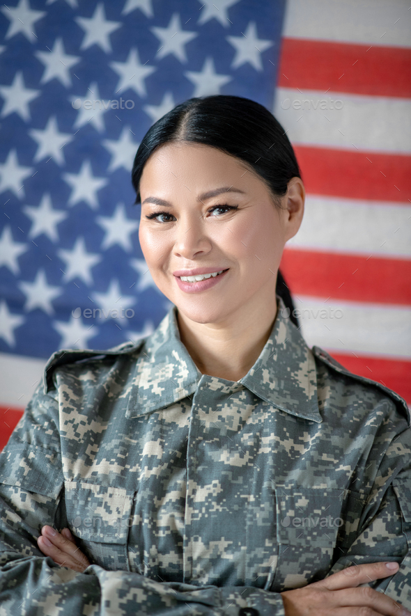 Beaming beautiful dark-eyed servicewoman wearing military uniform Stock ...