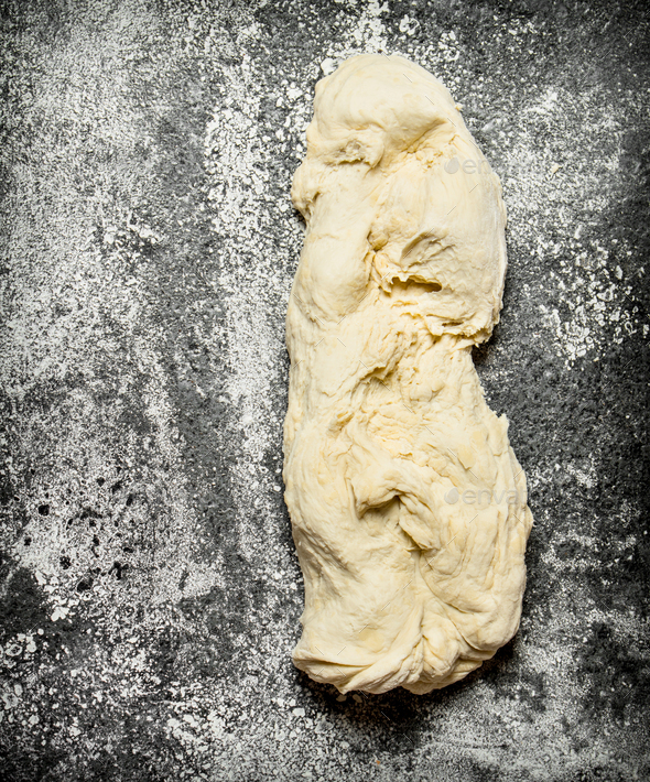 Dough background. A piece of fresh pastry. Stock Photo by Artem_ka