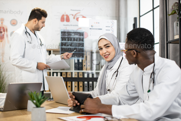 Qualified diverse doctors discussing x ray prints of patient Stock ...