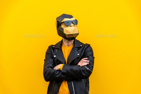 Man with funny low poly mask on colored background Stock Photo by ...