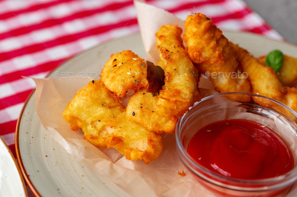Deep fried chicken nuggets with sauce served on table Stock Photo by ...