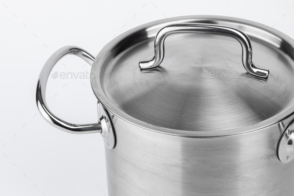 New metal cooking pot isolated on white Stock Photo by FabrikaPhoto
