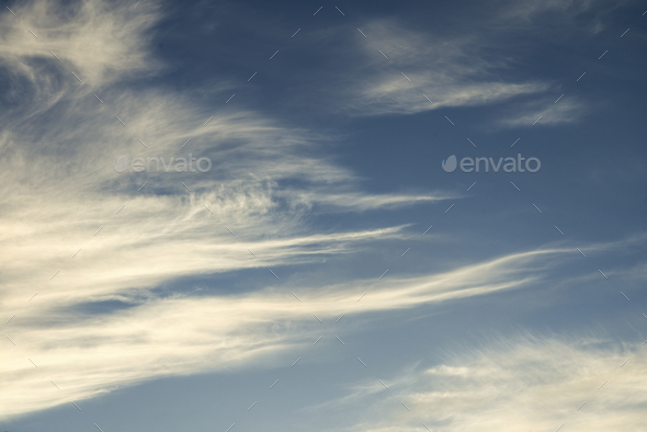 Layer filaments of cirrus clouds against a blue sky Stock Photo by ...
