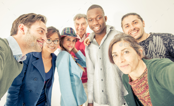 mixed group of people making party Stock Photo by oneinchpunchphotos
