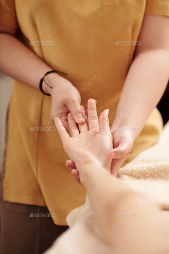 Therapist Massaging Palm Stock Photo by DragonImages | PhotoDune