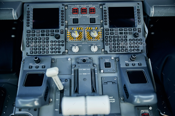 Panel with switchers inside pilot cockpit in jet Stock Photo by svitlanah