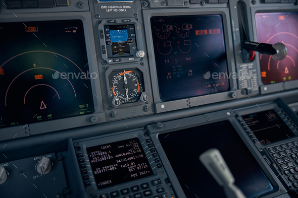 Airplane cockpit with flight displays, switches and knobs Stock Photo ...
